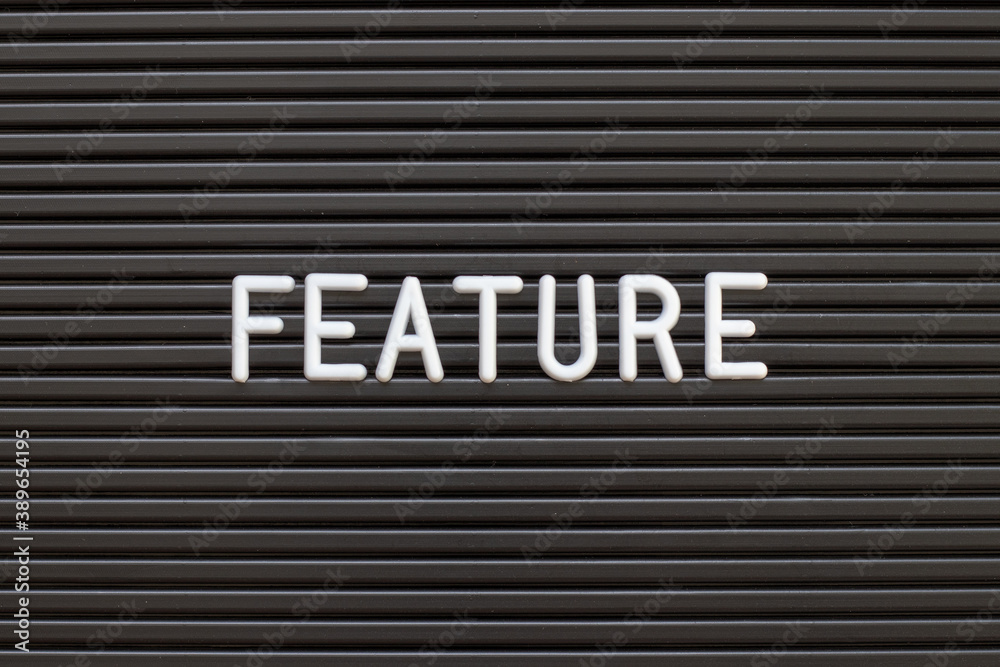 Black color felt letter board with white alphabet in word feature ...