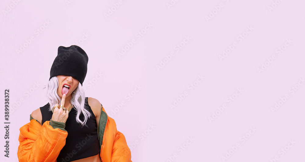 Blonde model in fashion urban street look. Trendy orange bomber jacket ...