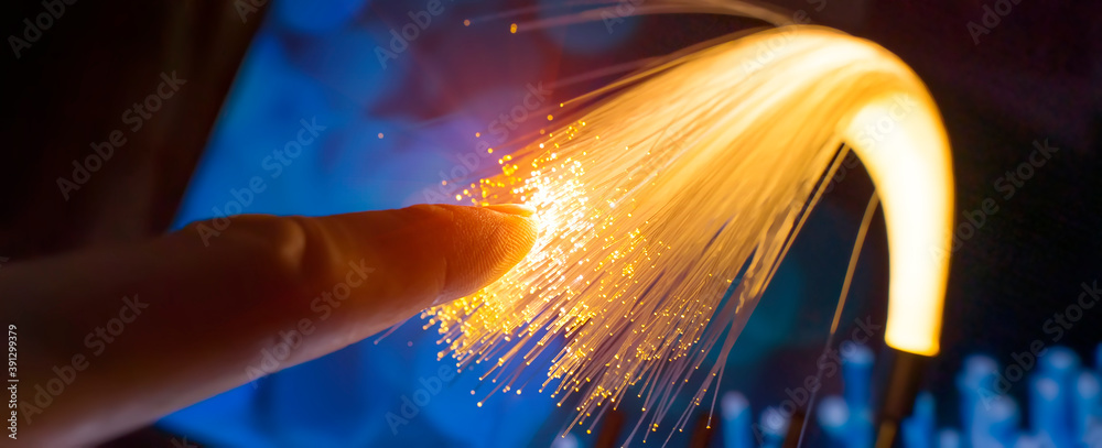 finger and fiber optic background Stock Photo | Adobe Stock
