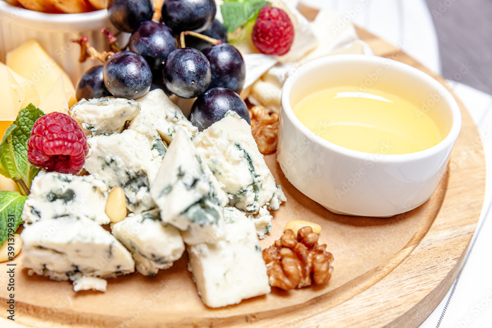 Board with different types of cheese. Cheeses mix set dor blu chedar ...