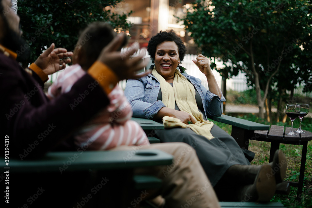 Black friends safely gathered and enjoying a backyard kickback party ...