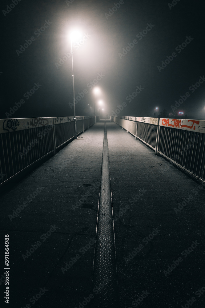 Moody and misty path (sidewalk) in the dark city at night with white ...