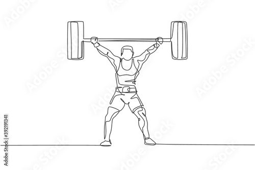 One single line drawing of fit young athlete muscular man lifting barbells working out at a gym ...