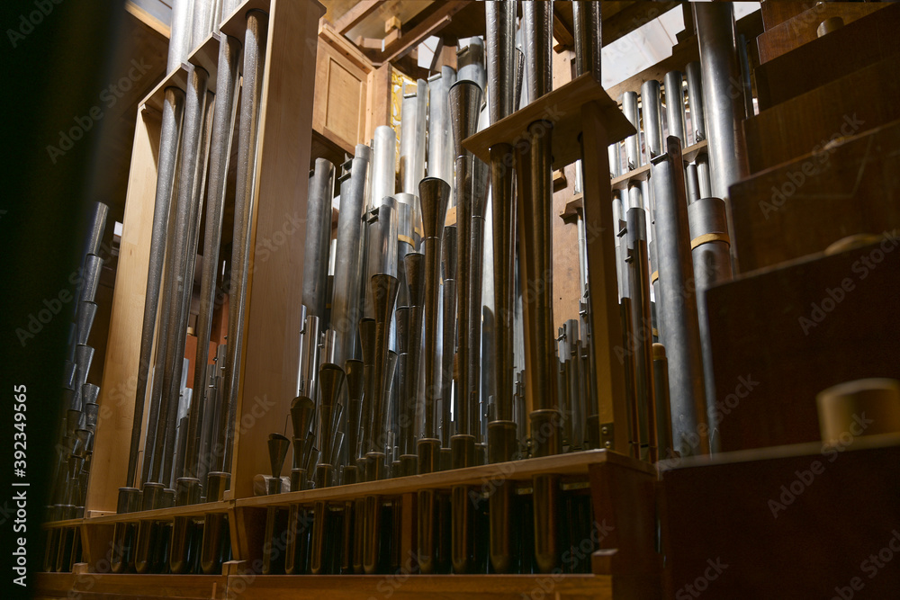Inside a church organ, register with different pipes from metal ...