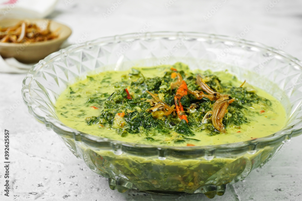 Sayur Ubi tumbuk / Mandailing crushed cassava leaves curry as ...