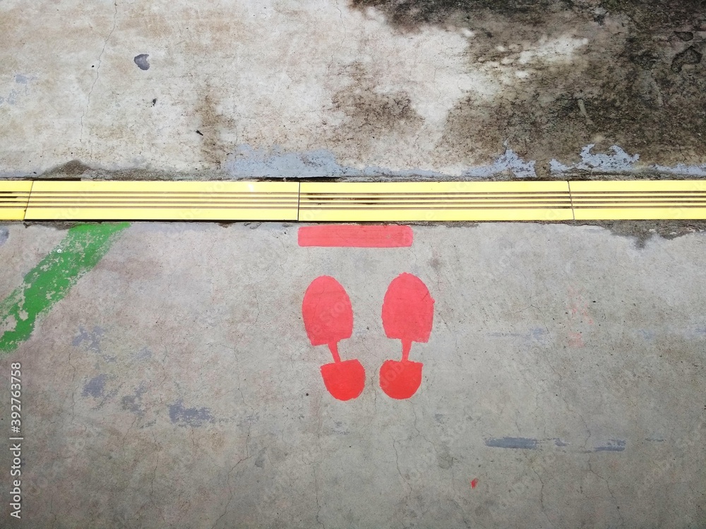 footprints is a sign of social distancing in public transportation ...