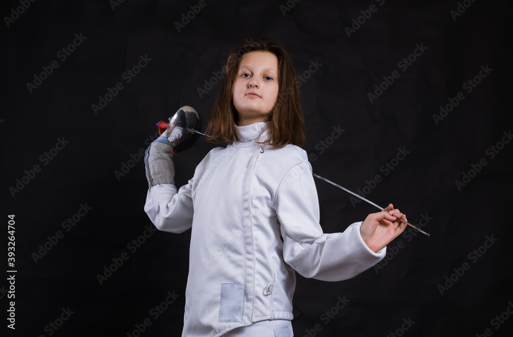 Teenage girl fencer dressed in uniform with epee and helmet Stock Photo ...