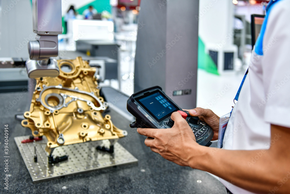 Mechanical engineer using coordinate measuring machine (CMM) 3d ...