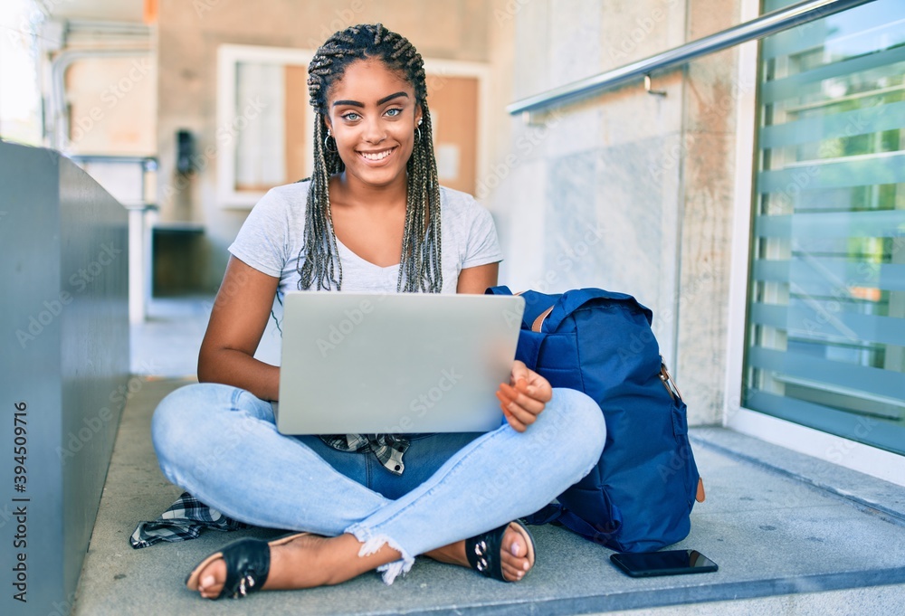 Young african american student woman smiling happy using computer ...