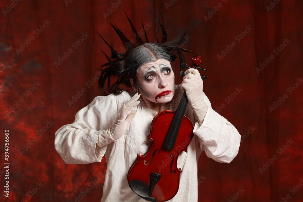 The art of depression. Studio portrait of young female model performing ...