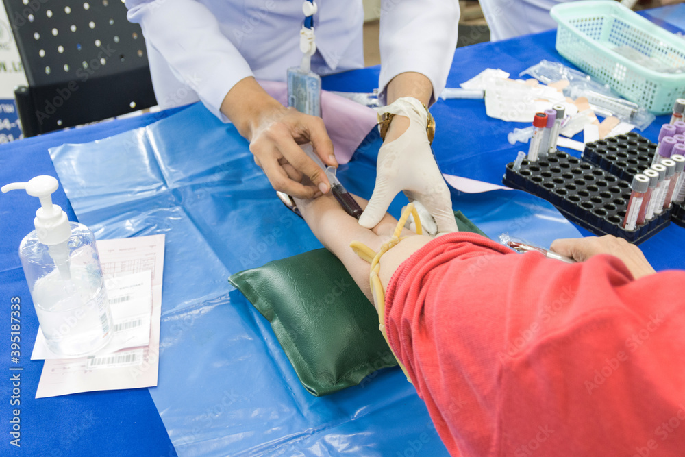 doctor injection needle on arm to collect blood for test the health ...