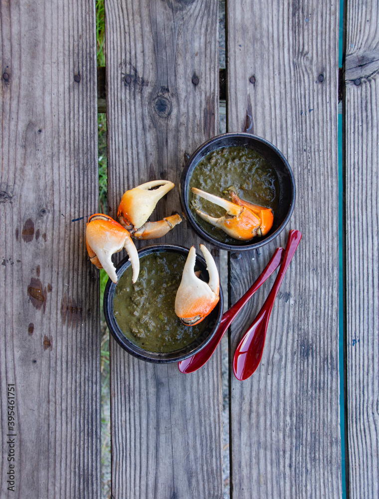 Taro leaves and coconut milk soup with land crab "Demok" is a ...