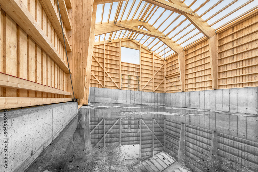 Large engineering hall in timber construction with a concrete base wall ...