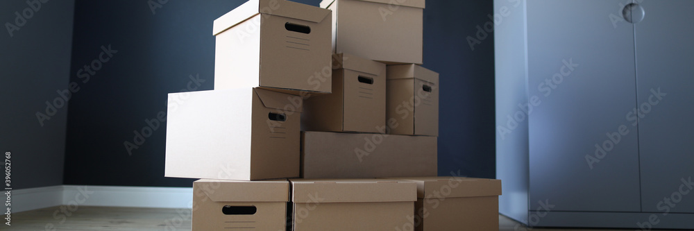Empty cardboard boxes stand in an empty room. Empty office interior ...