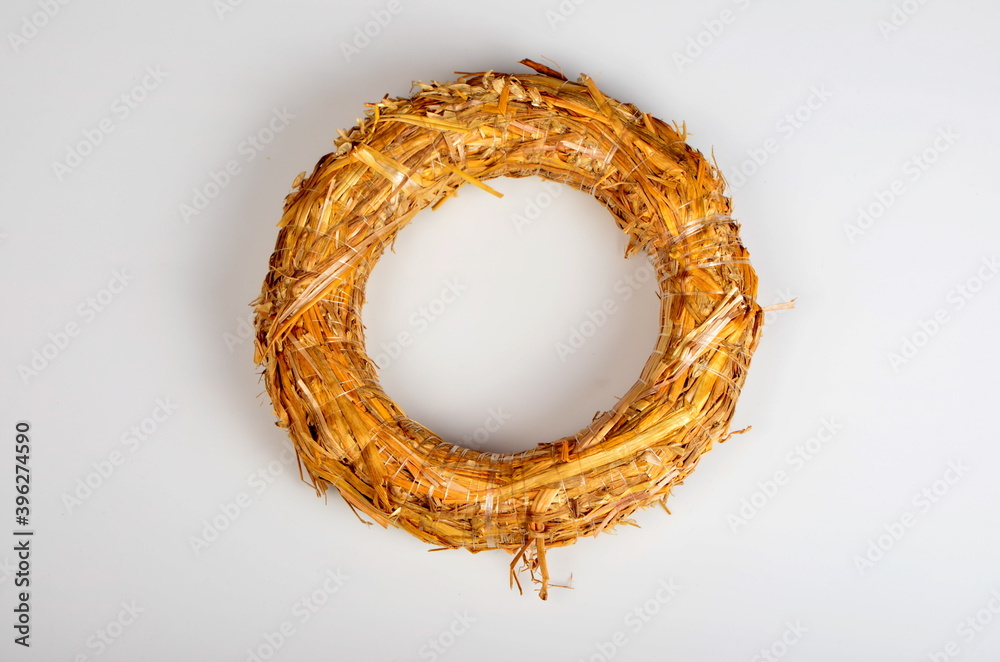 straw wreath on a white background. The foundation of the Advent wreath ...