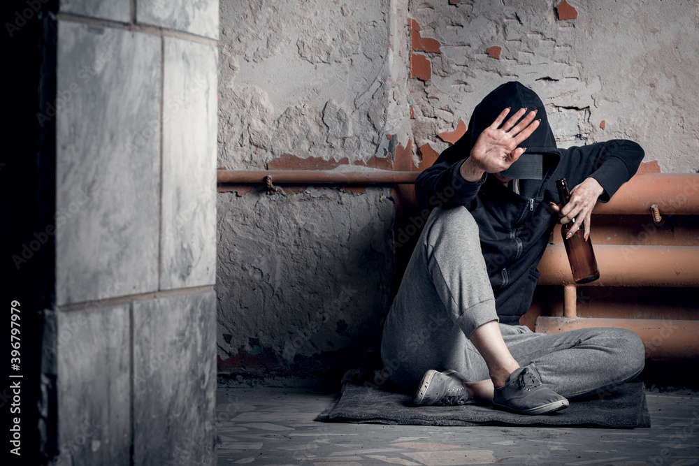 The concept of drug addiction and homelessness. A depressed and ...