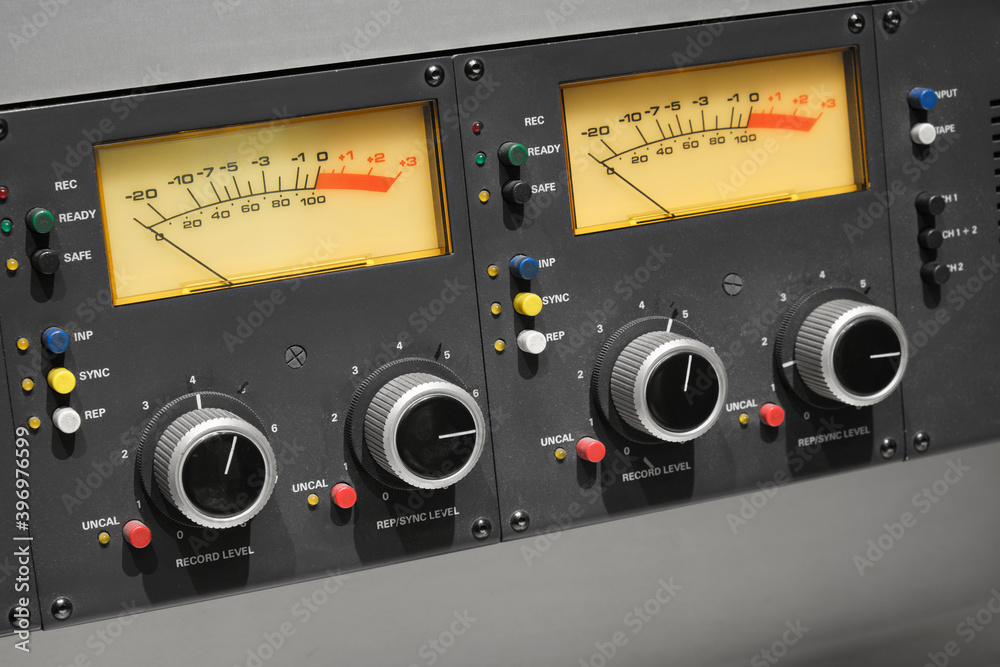 VU meter stereo on reel to reel tape recorder close up with control ...
