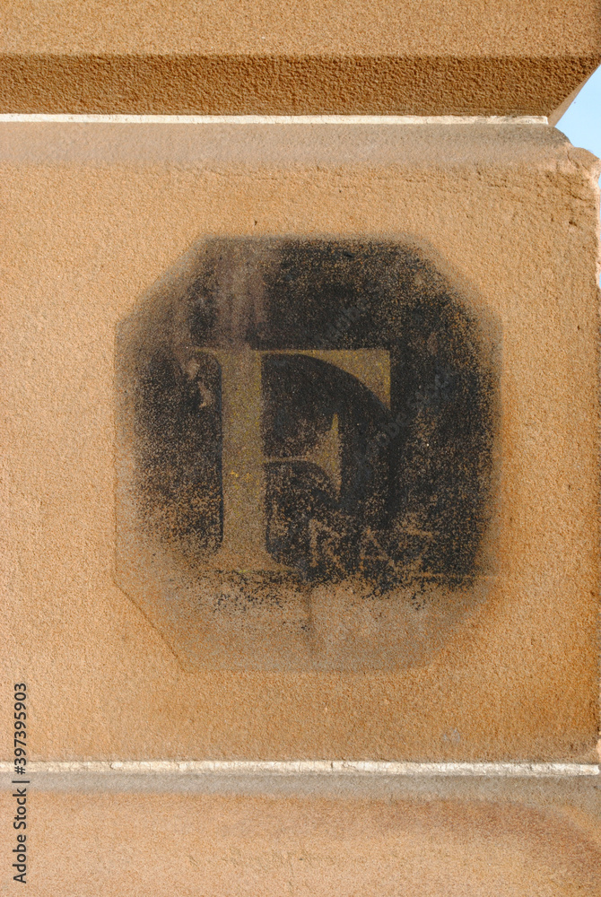 Very Old Faded Stencil of Letter F on Stone Wall of Public Building ...