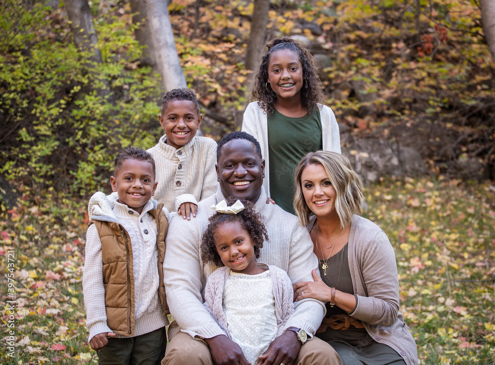 Posed Mixed Race family portrait outdoors with autumn colors Stock ...
