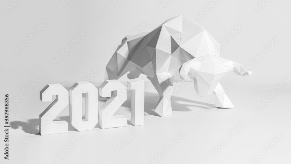 White volumetric paper bull papercraft and numbers 2021 on a white ...