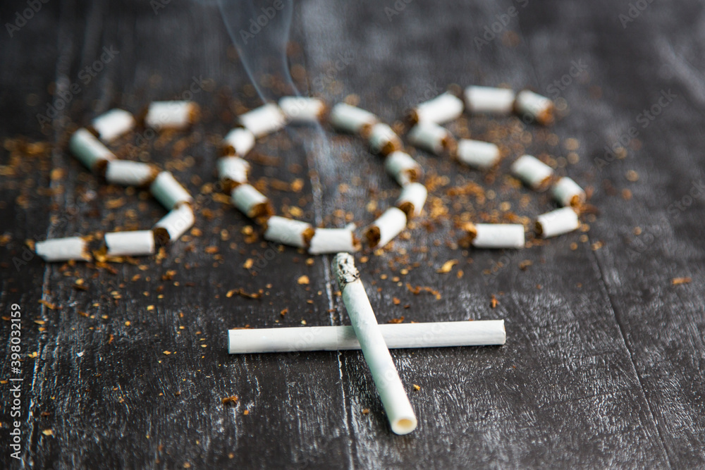 the ash and cigarette look like a cross, an artistic concept for world ...