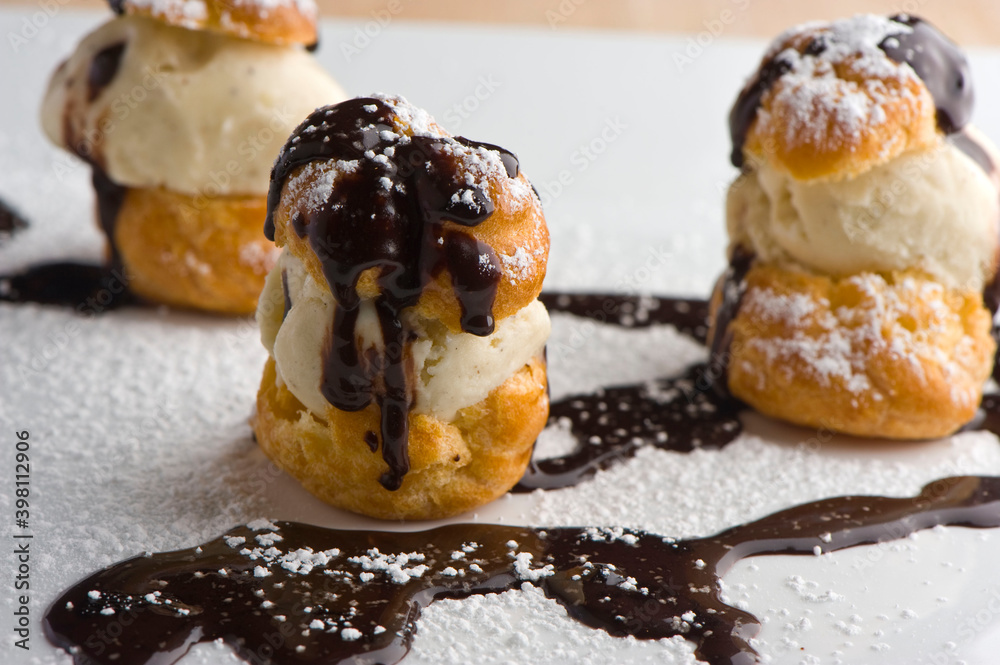 Profiteroles. Classic Italian dessert. Puff pastry filled with ...