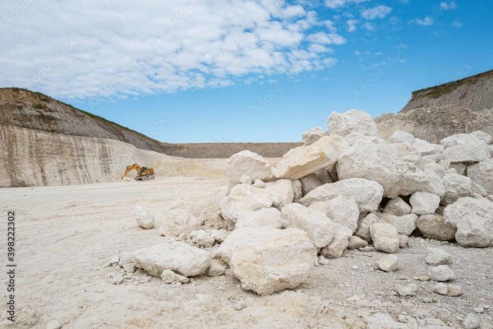 Pile of limestone rocks in the quarry containing 63 million year old ...