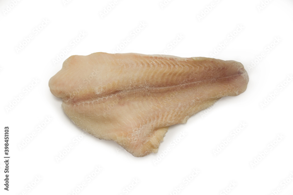 Fresh frozen sea fish on a white background. A piece of cod fillet ...