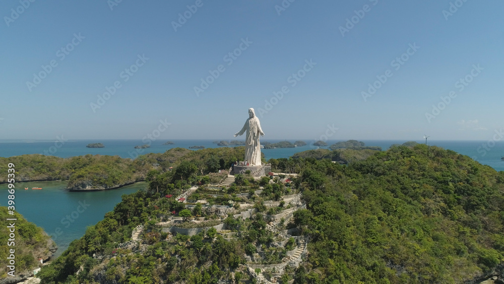 Statue of Jesus Christ on Pilgrimage island in Hundred Islands National ...