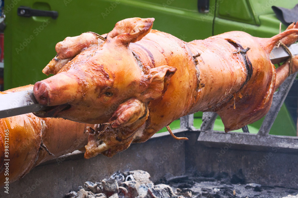 Traditional Balkan party food - whole piglet and lamb roasted on the ...