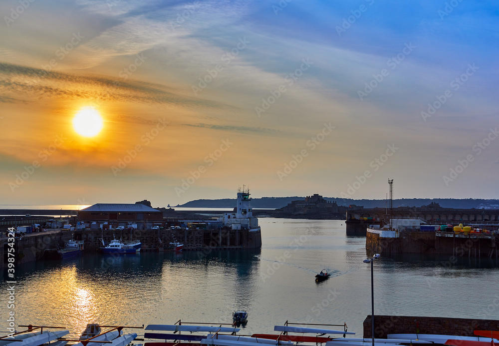 Image of St Helier Harbour Pierheads at sunset with Elizabeth Castle ...