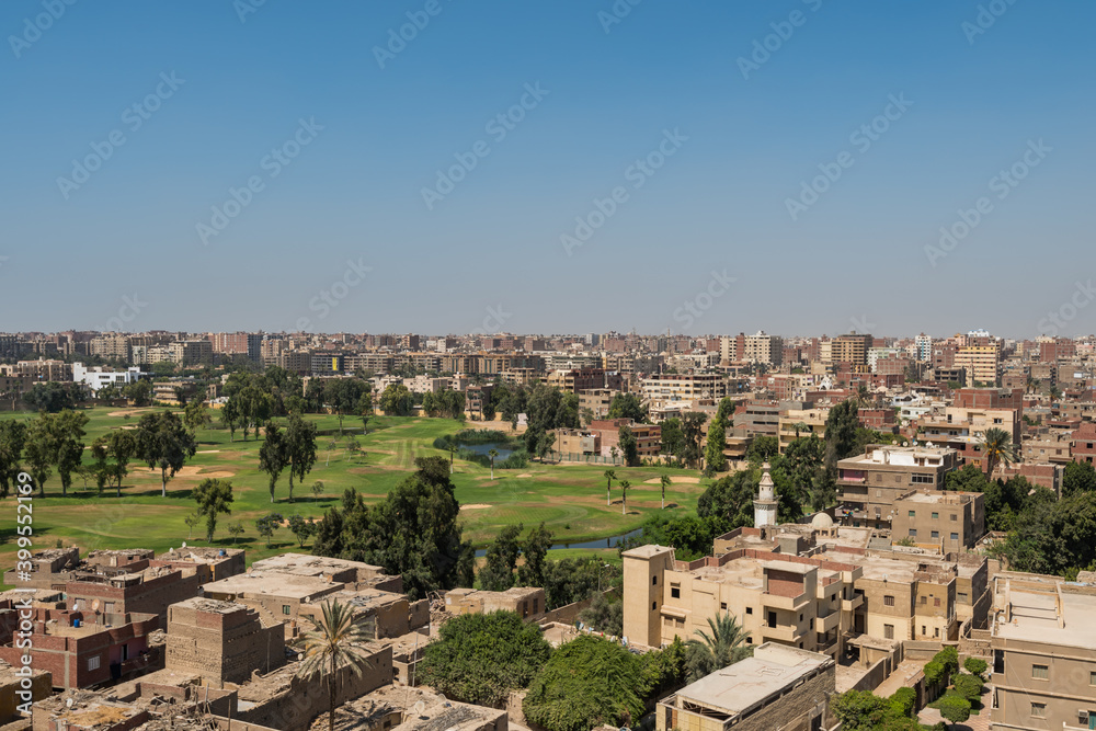 Aerial view of Cairo of red brick houses from the Giza pyramid complex ...