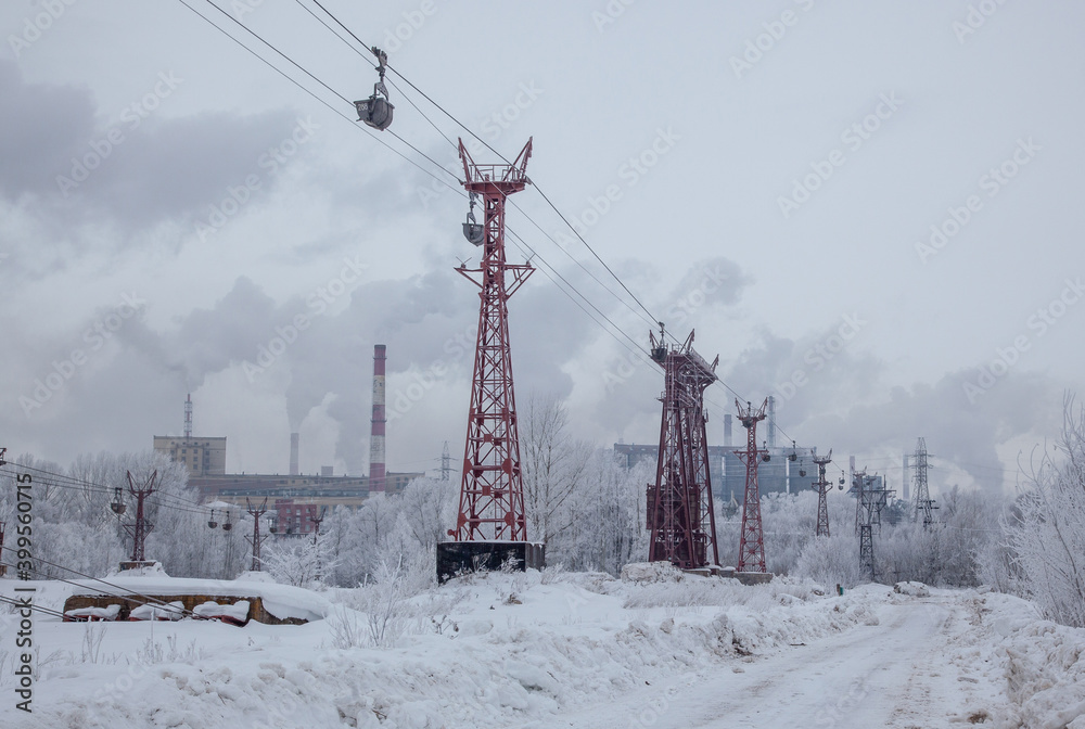 Industrial, winter landscape. Ropeway for transporting limestone ...