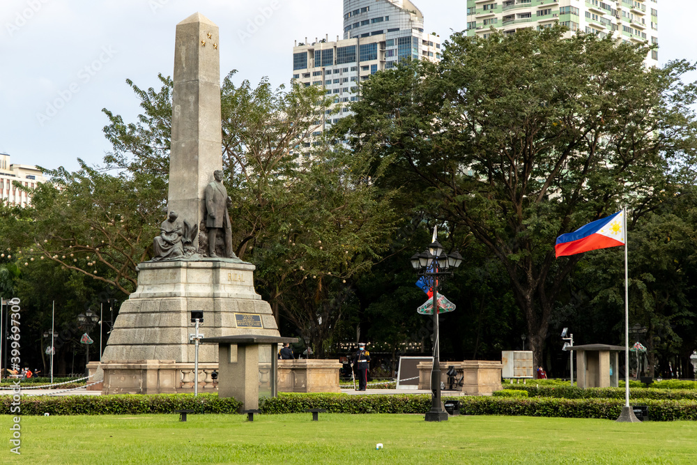 Dr. Jose Rizal National Monument and national flags in the wind, Manila ...