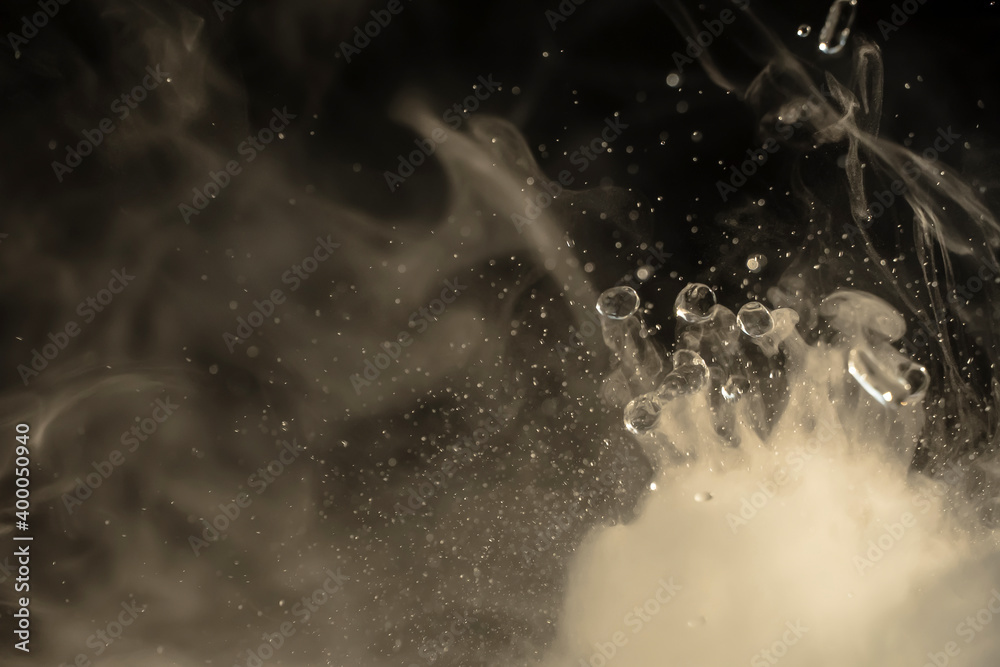 Water drop. Chemical reaction with boiling swirling water splashes ...