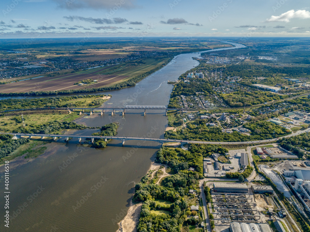 Large deep river. The river is crossed by two bridges. Road and railway ...