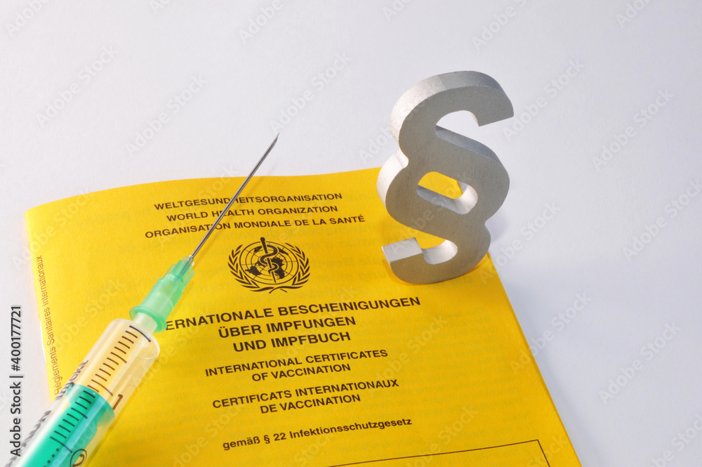 Hamburg / Germany - May 8, 2019: Vaccination books, an injection and a ...