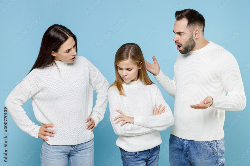 Angry dissatisfied upset young parents mom dad with child kid daughter ...