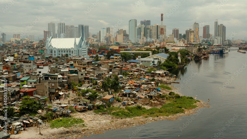 Manila is the capital of the Philippines with slums and poor district ...