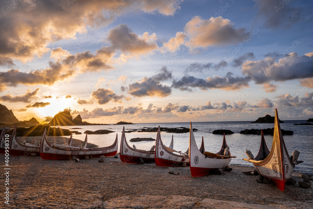 The traditional canoes of the aboriginal Tao tribe during sunrise in ...