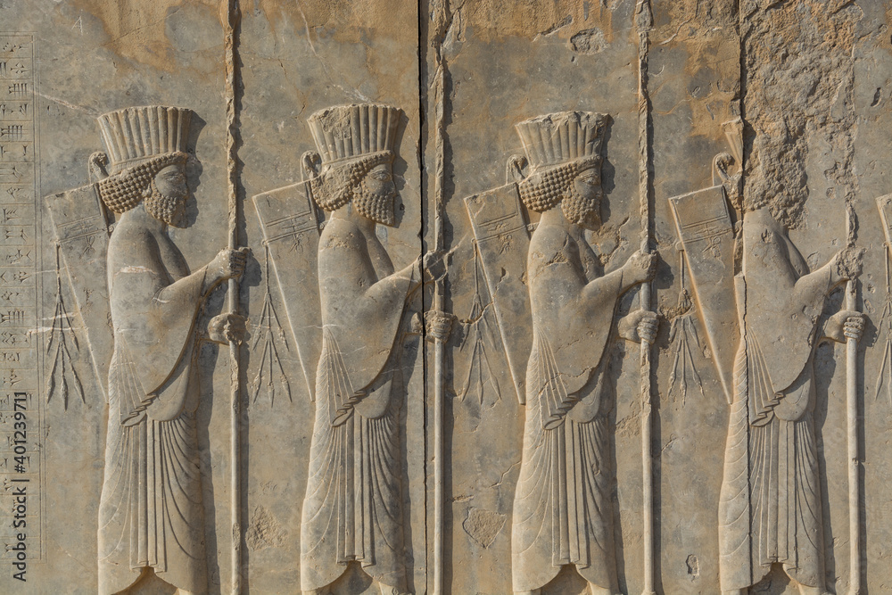 Foto de Stock Bas relief on the wall of ruins in the Persepolis in ...
