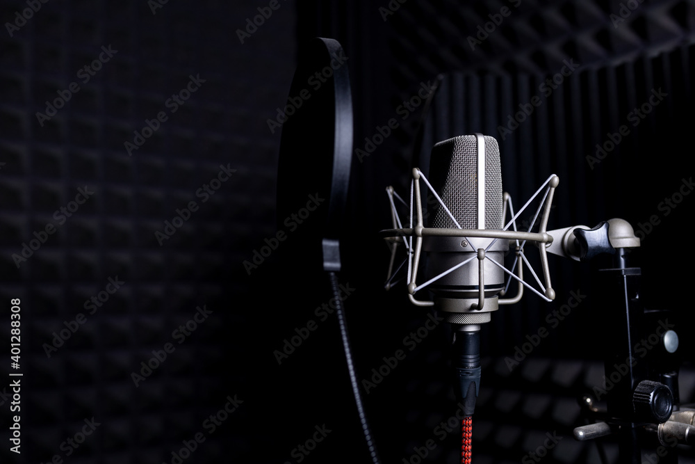 Contemporary metal microphone with wire placed on background of ...