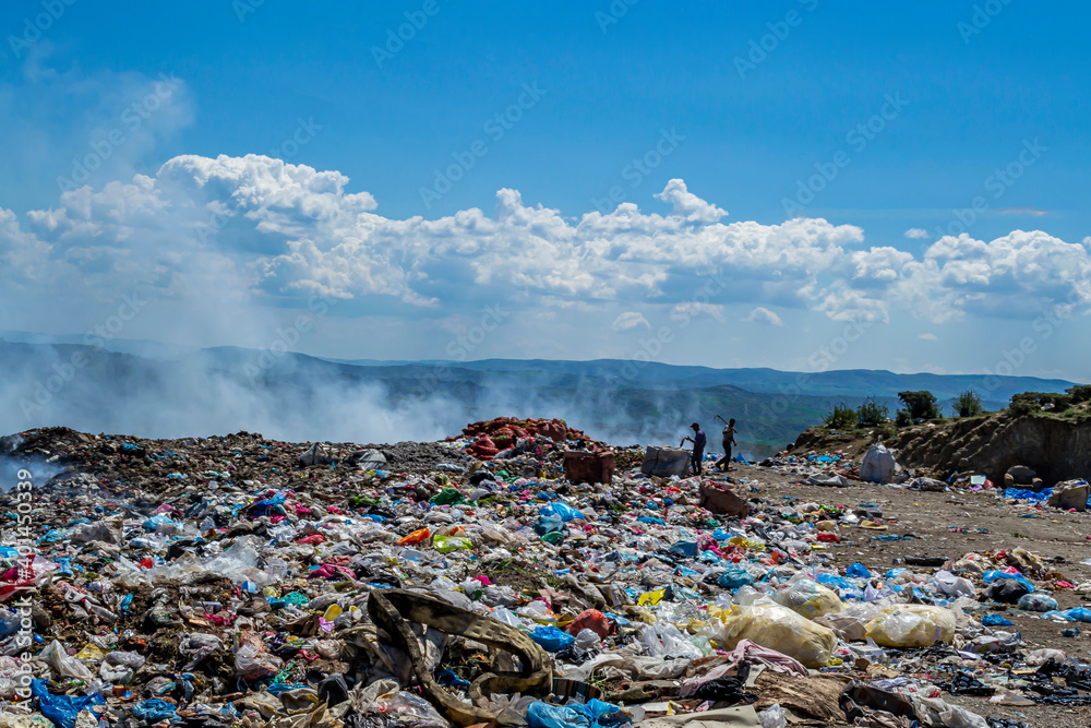 View of garbage field in trash dump or open landfill, food and plastic ...