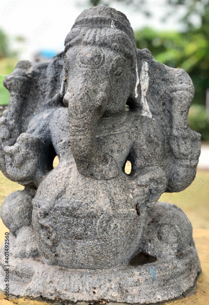 Hindu God deity statue. Ancient sandstone carved historical Hindu God ...