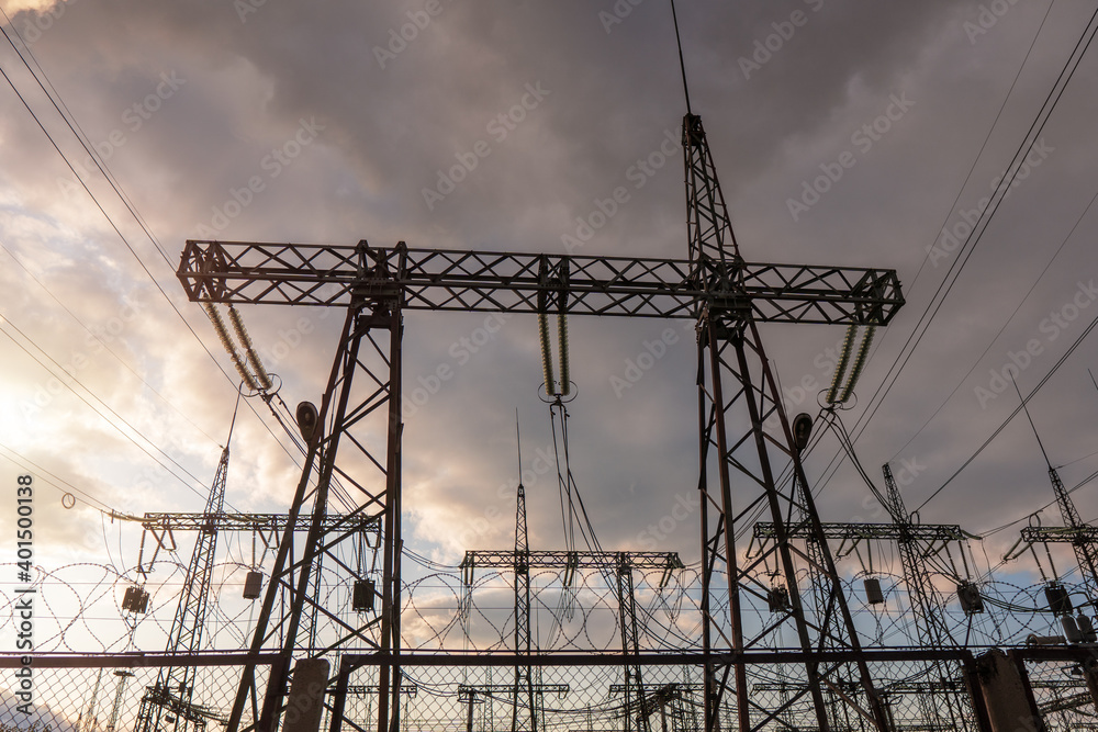distribution electric substation with power lines silhouette on the ...