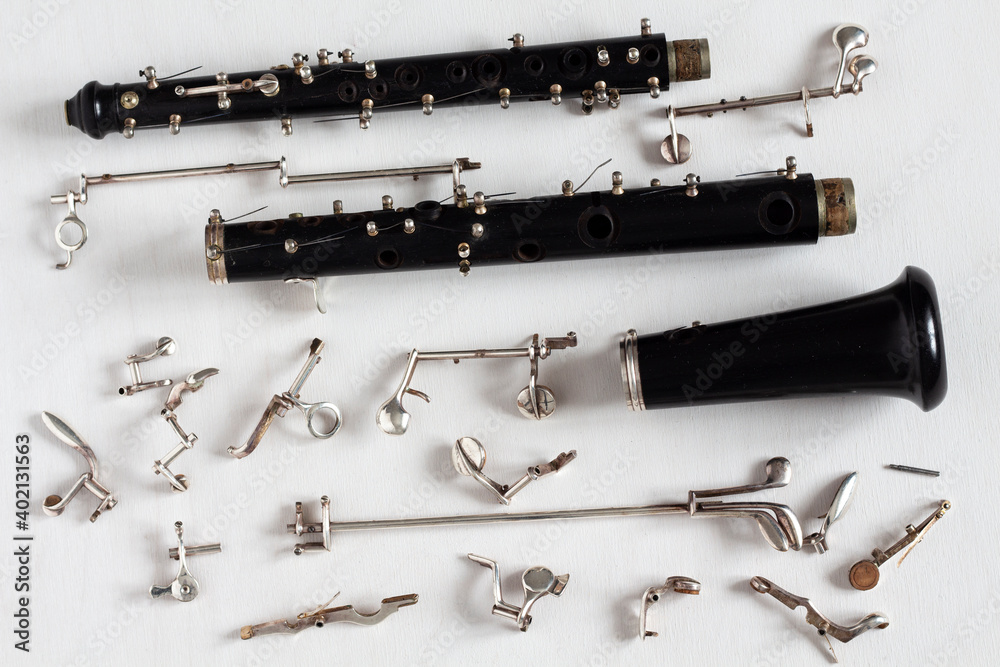 Old broken oboe. Repair of musical instruments. Stock Photo | Adobe Stock