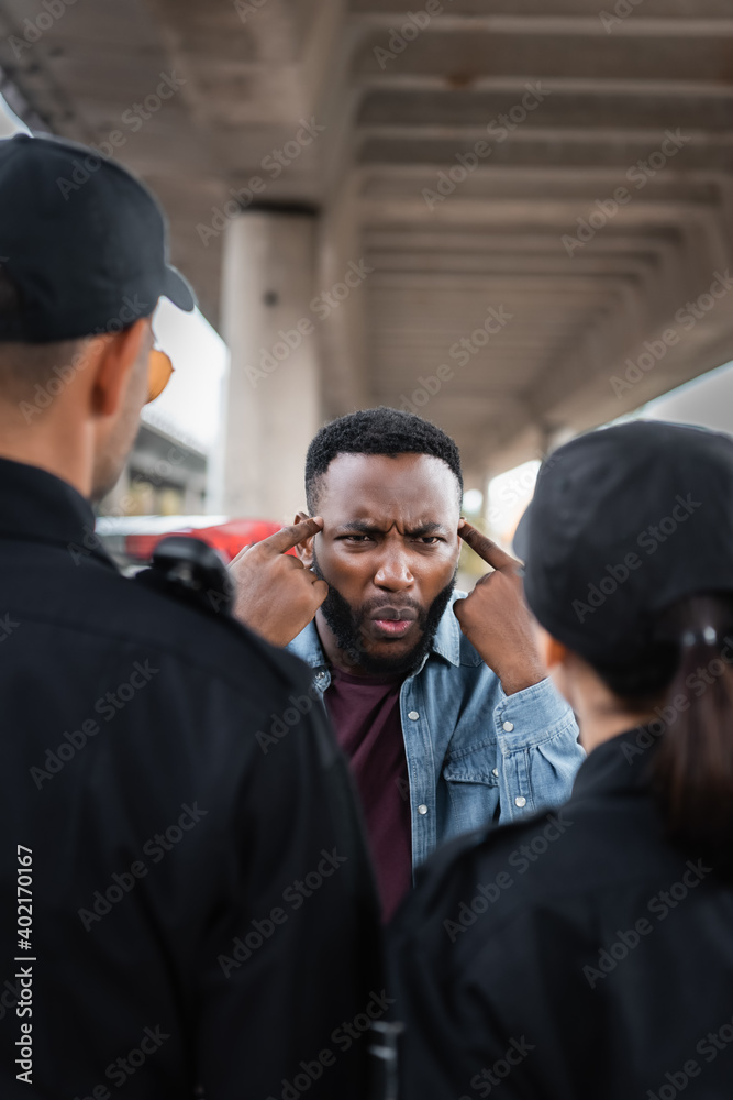 angry african american victim showing you are insane gesture while ...