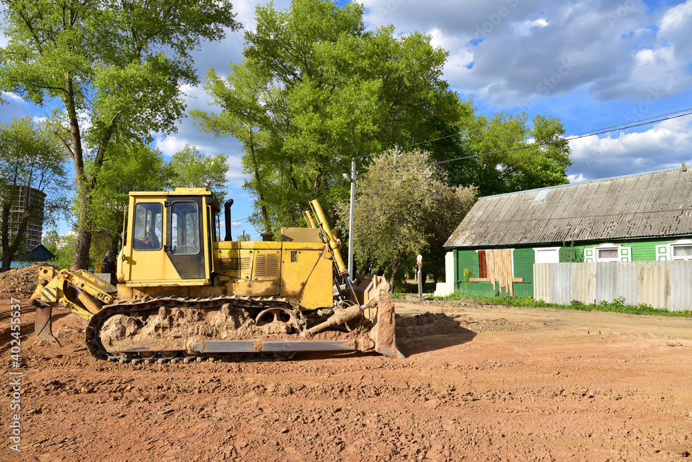 Dozer working on demolition at construction site. Bulldozer for land ...