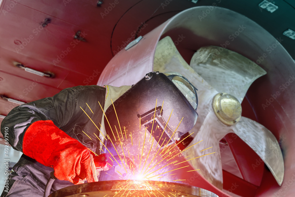 Industry building ship, Welder is Welding worker with spark weld ...