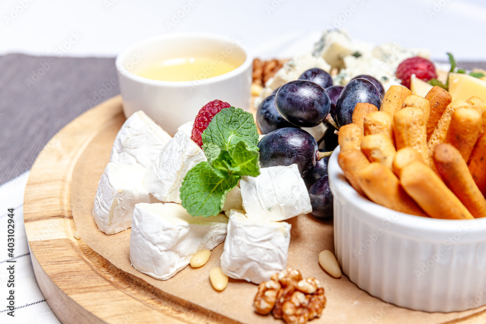 Board with different types of cheese. Cheeses mix set dor blu chedar ...